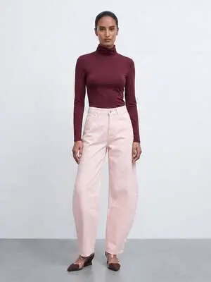 Alaïa Curved Dyed Denim Jeans