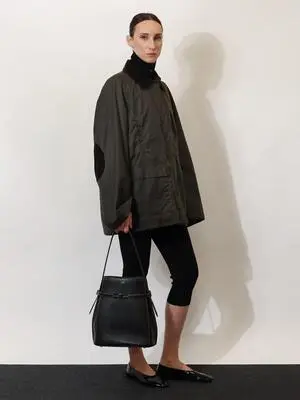 TOTEME Hammered Leather Bucket Bag With Strap On The Front - Black