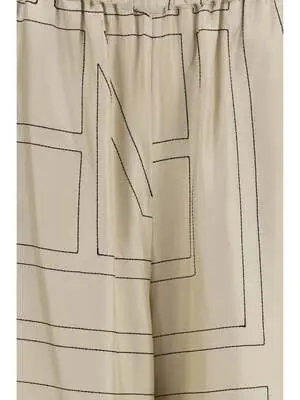 TOTEME Silk Monogram Pants