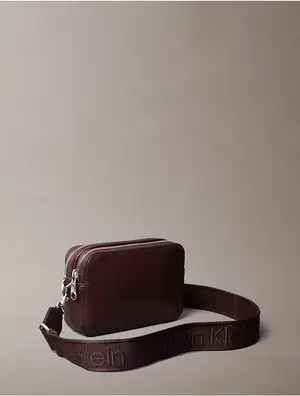 Calvin Klein Embossed Logo Crossbody Bag - Fudge