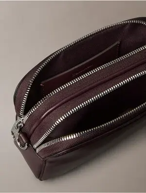 Calvin Klein Embossed Logo Crossbody Bag - Fudge