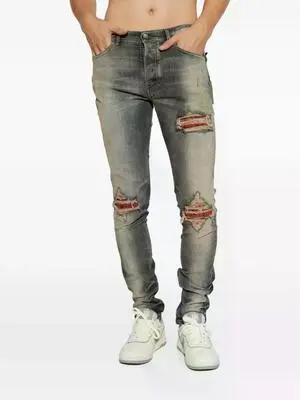 Amiri Distressed Patchwork Jeans