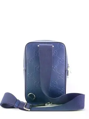 Gucci Gg Embossed Perforated Leather Sling Backpack - Blue