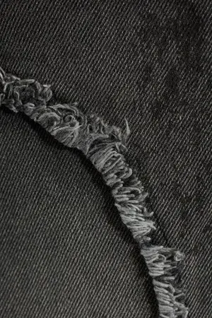 CARNE BOLLENTE Vintage Effect Jeans With Distressed Heart Detail