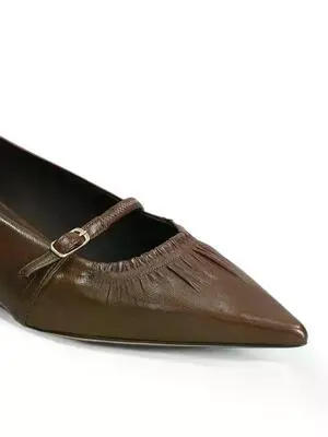 THE SELLER Pointed-toe Buckled Pumps
