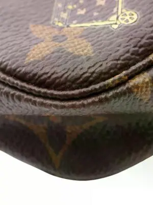 LOUIS VUITTON 2011 Monogram Illustre Mini Pochette Accessories Handbag - Brown