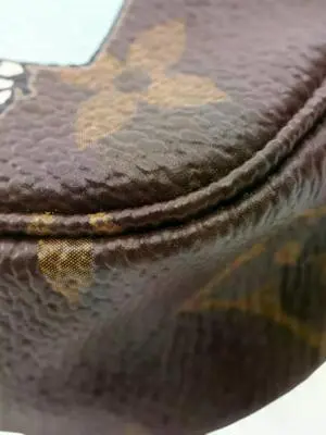 LOUIS VUITTON Monogram Illustre Mini Pochette Accessories Handbag - Brown
