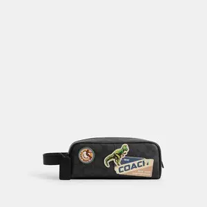 COACH OUTLET Travel Kit In Signature Canvas With Patches