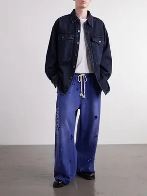 SATOSHI NAKAMOTO Luke Logo-printed Paint-splattered Distressed Cotton-jersey Drawstring Sweatpants