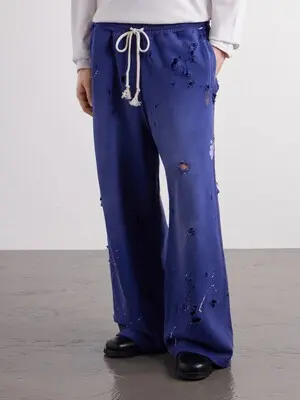 SATOSHI NAKAMOTO Luke Logo-printed Paint-splattered Distressed Cotton-jersey Drawstring Sweatpants