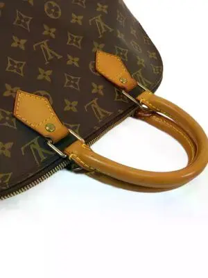 LOUIS VUITTON Alma Monogram Handbag