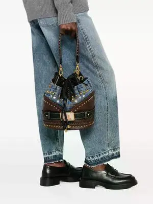 LA CARRIE Stud-embellished Denim-detail Bucket Bag