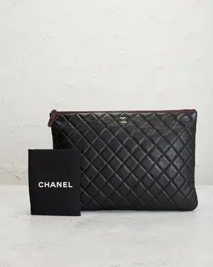 FWRD RENEW Chanel Lambskin O Case Clutch