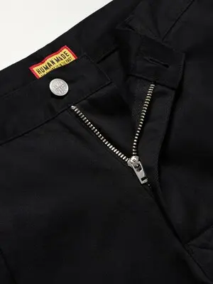 HUMAN MADE Tapered Pleated Cotton-canvas Trousers