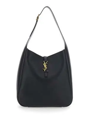 Saint Laurent Le 5 À 7' Shoulder Bag With Claw Cassandre Closure And Adjustable Strap In Hammered Leather - Black