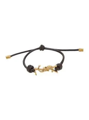 Saint Laurent Bracelet With Gold Cassandre Logo Plate And Adjustable Closure In Leather For