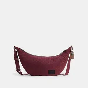 COACH Leon Sling Bag In Signature Nylon Jacquard - Light Maroon