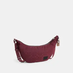 COACH Leon Sling Bag In Signature Nylon Jacquard - Light Maroon