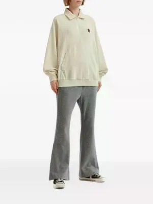 FINGERCROXX Ribbed-knit Logo-patch Flared Trousers