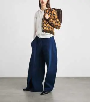 A.W.A.K.E. Mode Asymmetric Wrap-detail Jeans