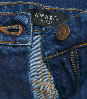 A.W.A.K.E. Mode Asymmetric Wrap-detail Jeans