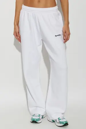 Sporty & Rich Track Pants From 'the Essentials' Collection