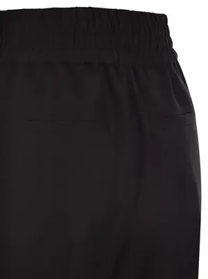 Brunello Cucinelli Baggy Pull-up Trousers In Viscose And Linen Fluid Twill - Black