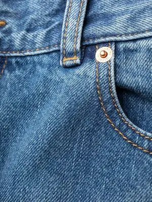 Valentino Garavani Washed Denim Jeans With Archive 1985 Print