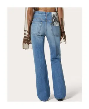 Valentino Garavani Washed Denim Jeans With Archive 1985 Print