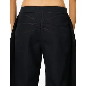 Alaïa Petal Curved-leg Wool Denim Trousers