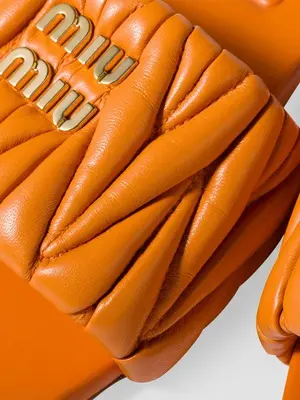 Miu Miu Matelasse Nappa Leather Slides - Orange