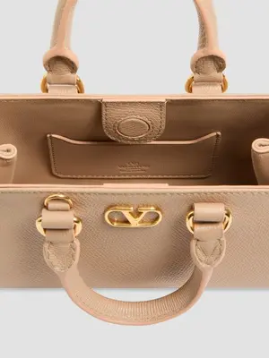 Valentino Garavani Mini Vlogo Signature Top Handle Bag In Grainy Calfskin - Beige