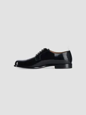 Givenchy Tux Derbies In Brushed Leather