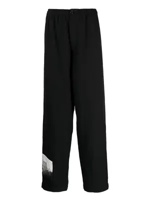 UNDERCOVERISM Graphic-patch Wool Trousers - Black