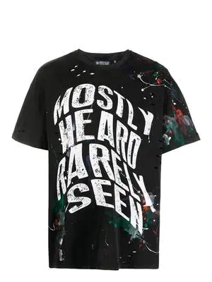 MOSTLY HEARD RARELY SEEN Warped-text Paint T-shirt - Black