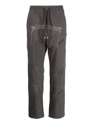 CHILDREN OF THE DISCORDANCE Logo-embroidered Distressed Track Pant - Grey