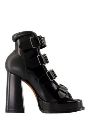 ALEXANDER MCQUEEN Buckled Leather Pumps