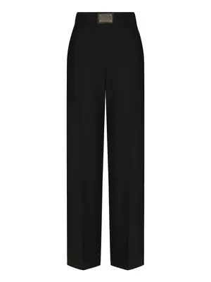 Dolce & Gabbana Flared Wool Pants With Logo Tag - Black