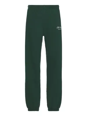 SPORTY & RICH X Hotel Carlyle Script Embroidered Sweatpant In Dark Green - Forest