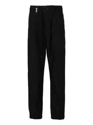 Versace Tapered-leg Trousers With Logo Strap - Black