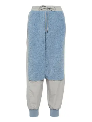 JW Anderson Paneled Faux Shearling Sweatpants - Blue