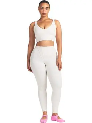 SKIMS V Neck Bra Top | White | | Nike Matte - Ivory