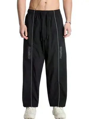 PLEASURES Sound Logo-print Reflective Track Pants - Black