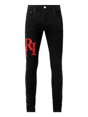 Amiri Skinny Jeans With Staggered Logo Detail - Black