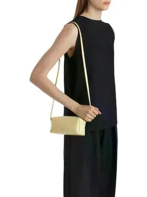 Khaite Mini Kye Crossbody Bag In Pale- Crackle-patent Leather - Yellow