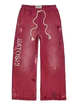 SATOSHI NAKAMOTO Distressed Paint-splatter Track Pants - Red