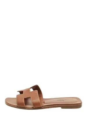 Hermès Oran Cutout Leather Slides - Brown