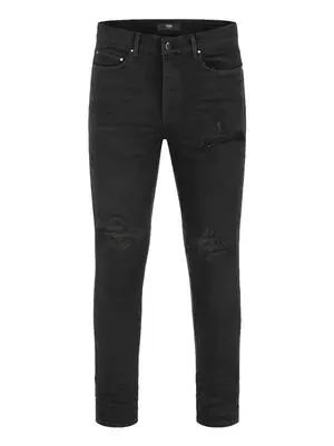AMIRI Distressed Ribbed-panel Jeans