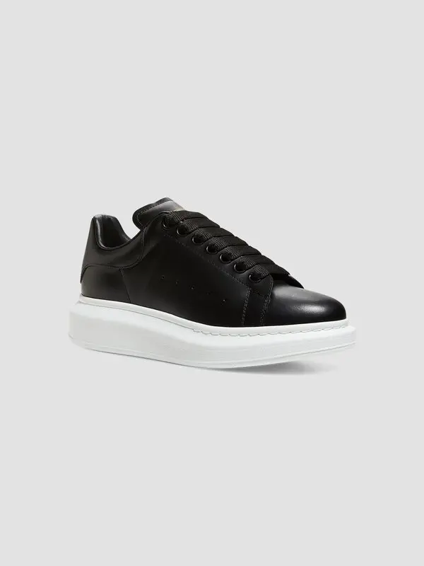 Alexander McQueen S Oversized Embossed Logo Leather Sneakers - Black