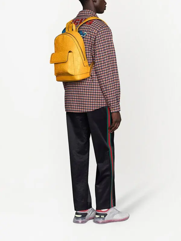 Gucci Gg Embossed Backpack - Yellow | Editorialist display picture 3